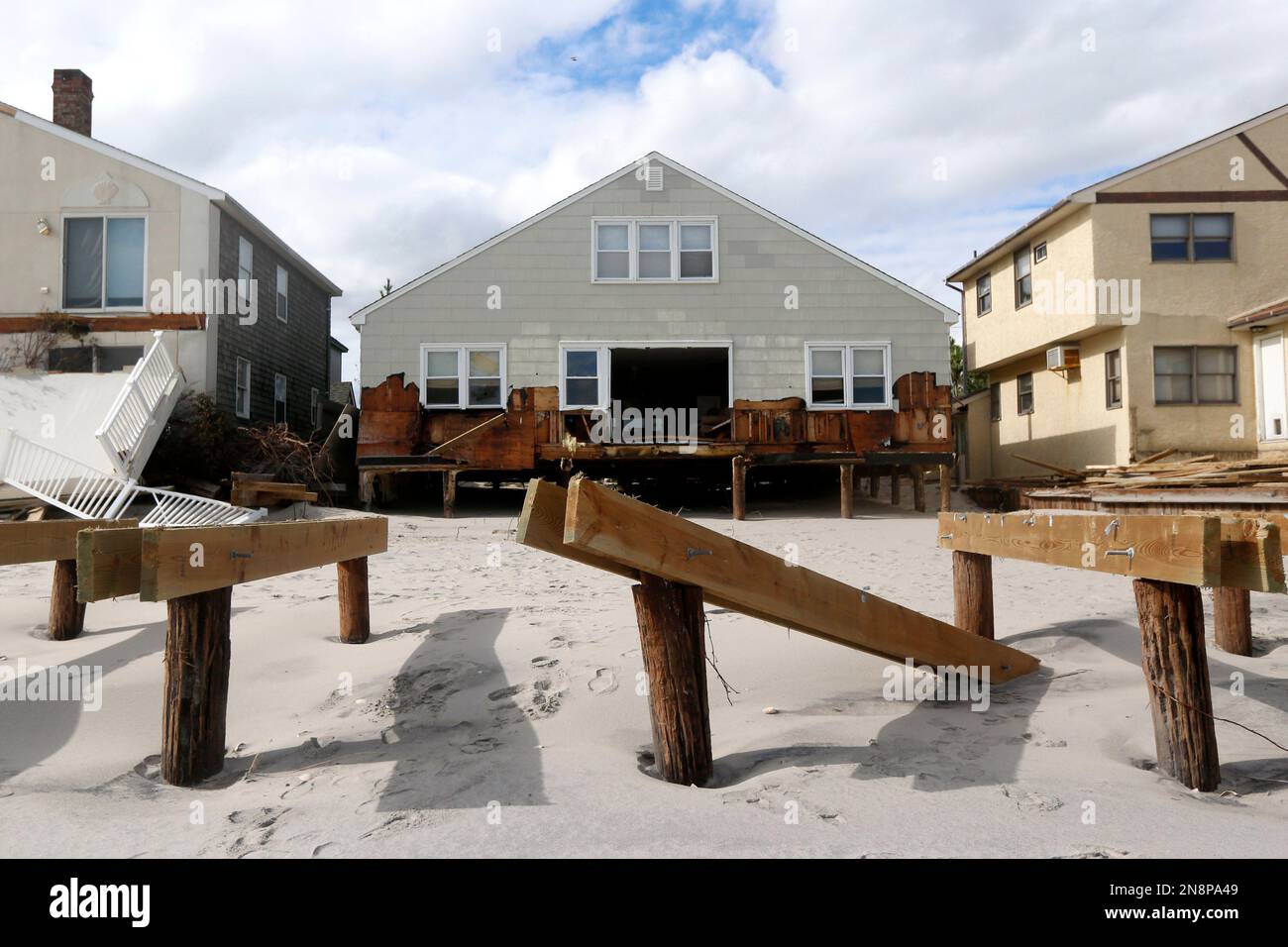 The planks of a boardwalk are all that remain after superstorm Sandy ...