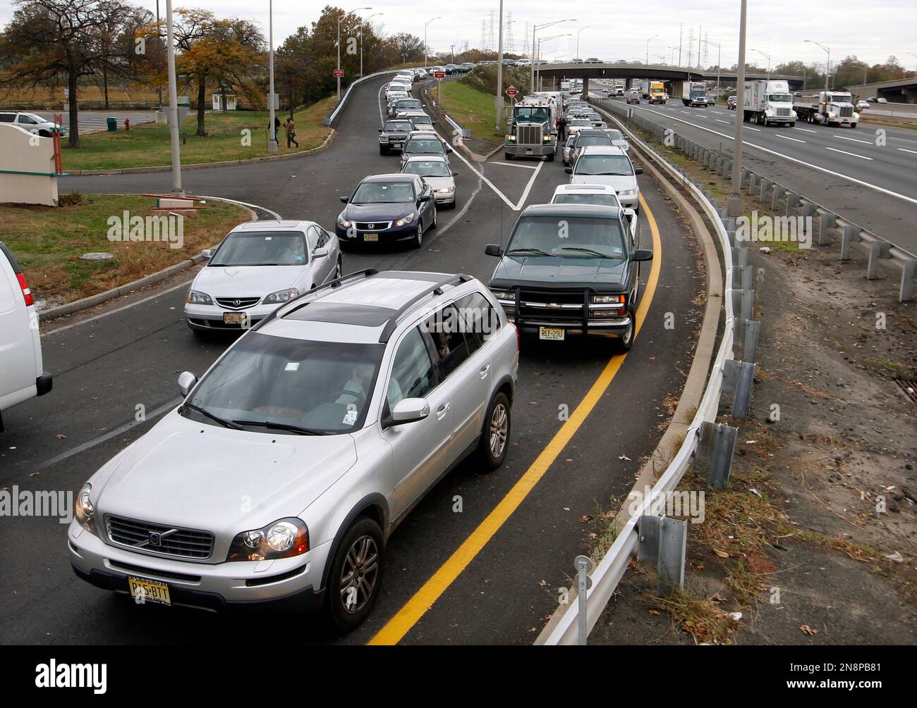 Cars line up for gas at the New Jersey Turnpike's Thomas A. Edison ...