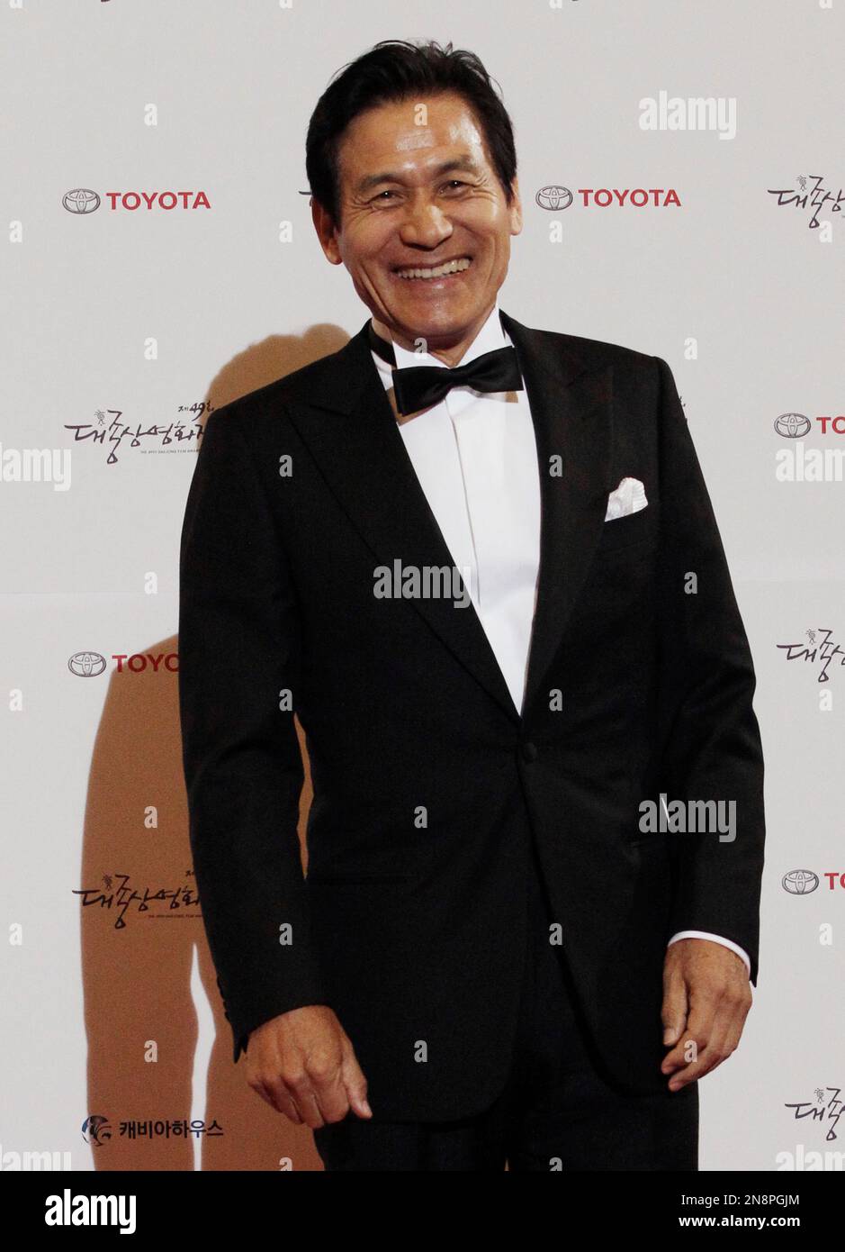 South Korean Ahn Sung-ki poses for a photo call during the Daejong Film ...
