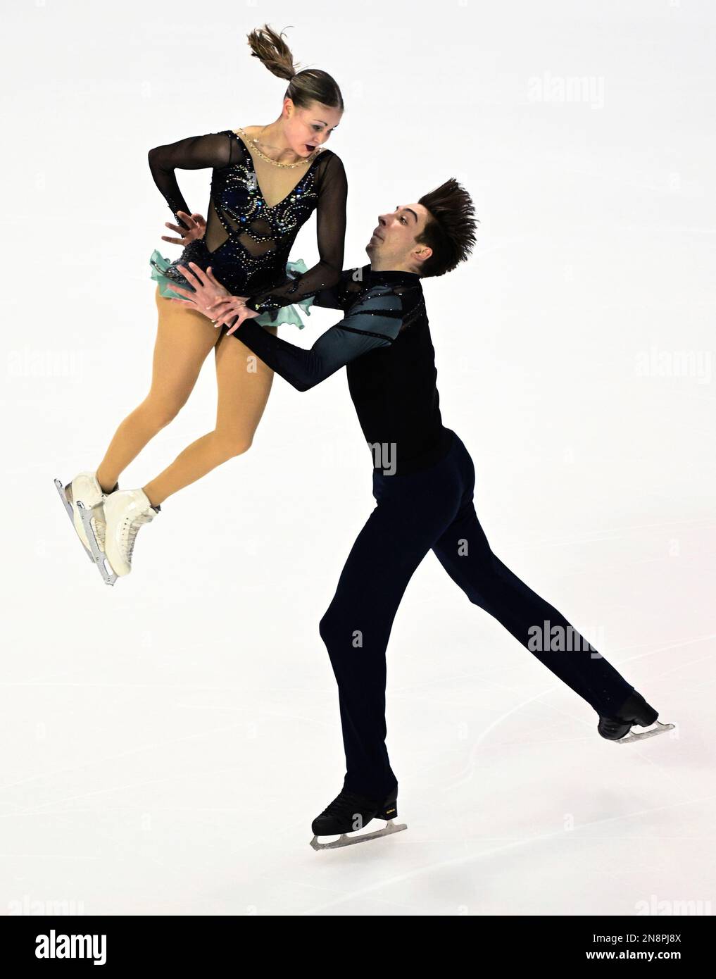 Kelly Ann Laurin and Loucas Ethier, of Canada, compete in the pairs ...