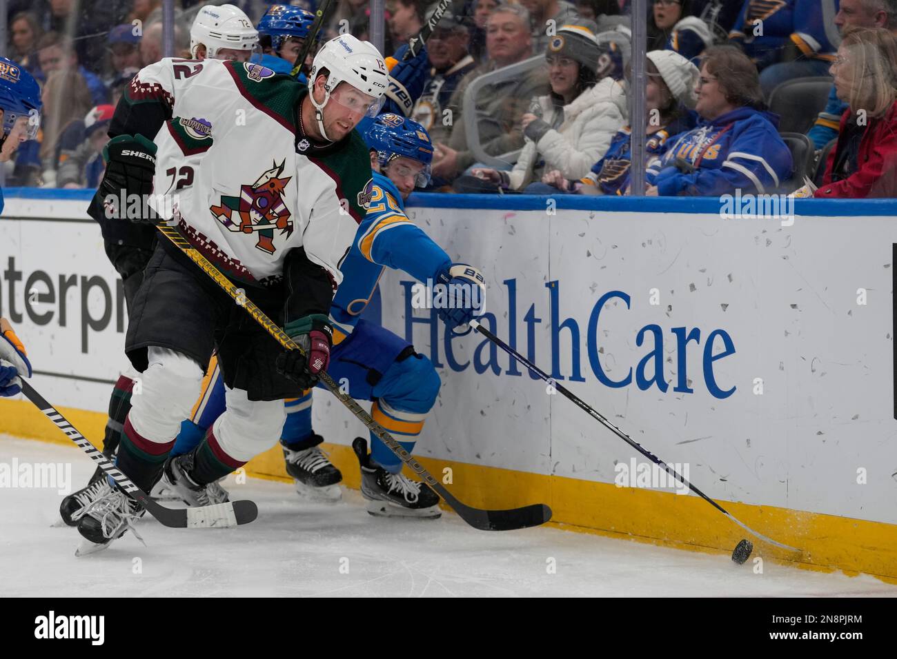 Arizona Coyotes' Nick Ritchie (12) and St. Louis Blues' Nathan Walker ...