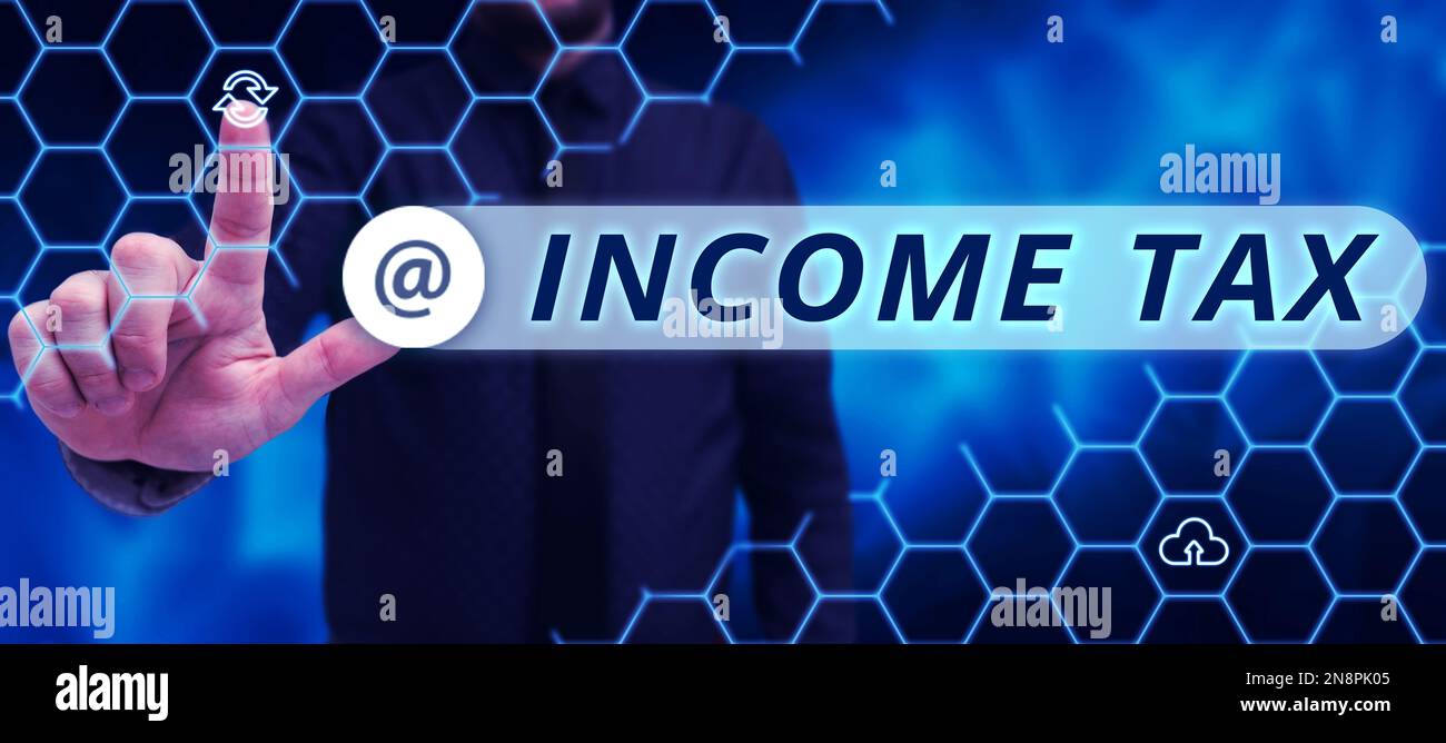 Hand writing sign Income Tax. Concept meaning Annual charge levied on ...