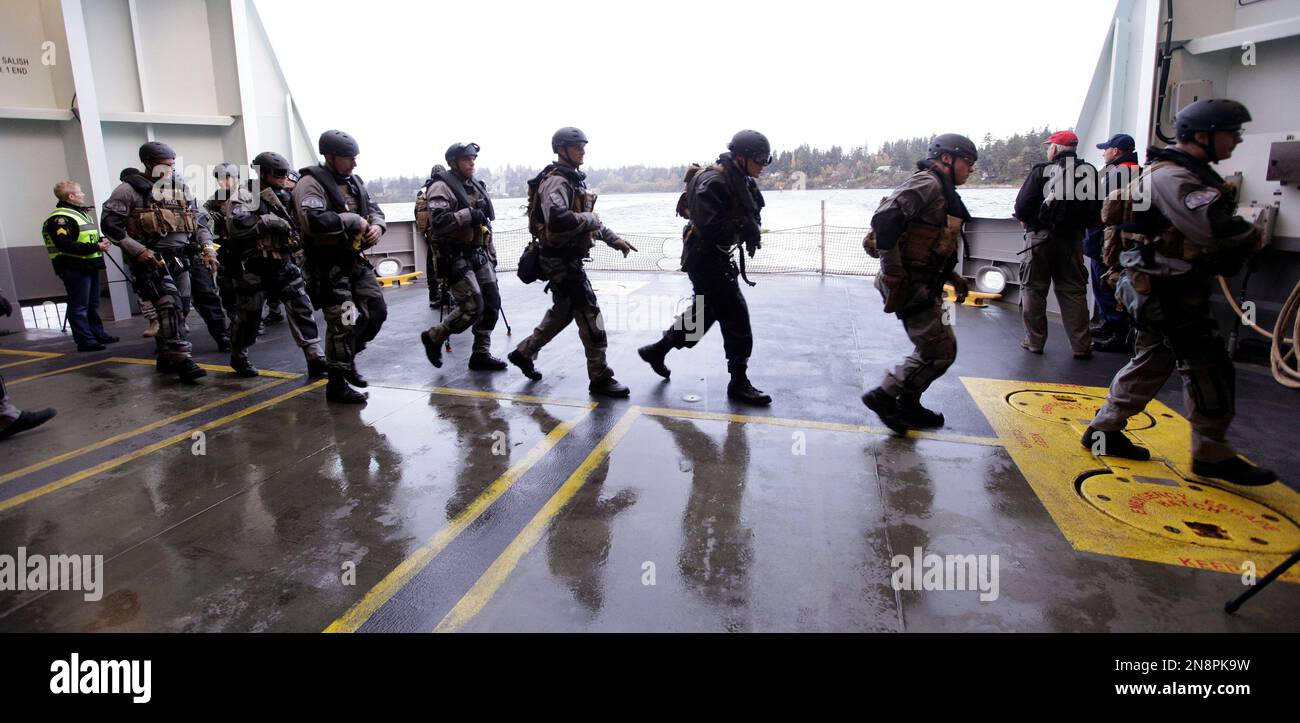 During a drill, SWAT team members prepare to "secure" the ship Monday ...