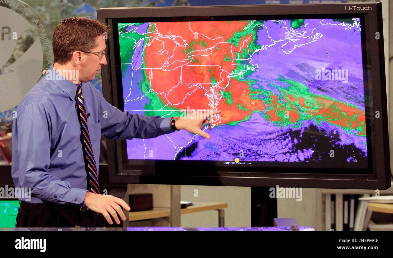 Rick Knabb, director of the National Hurricane Center, points to the ...