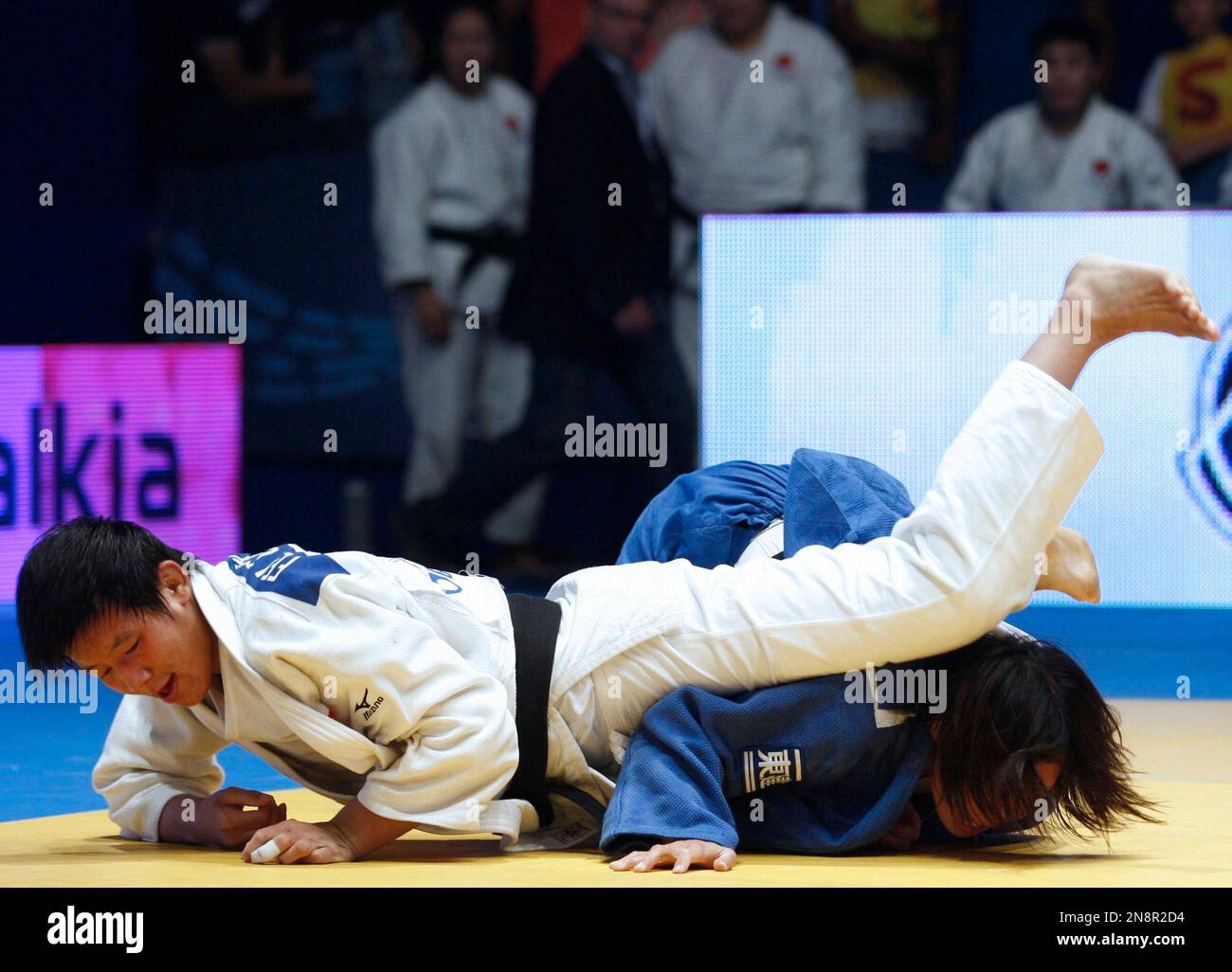 Japan's Yuko Imai, bottom right, fights with China's Fei Chen in the ...