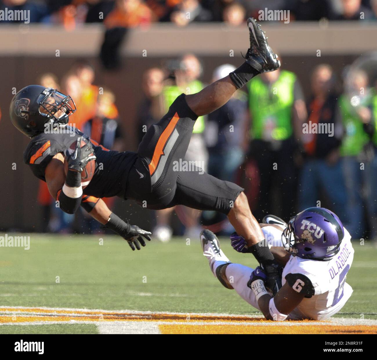 TCU safety Elisha Olabode, right, tackles Oklahoma State running back ...