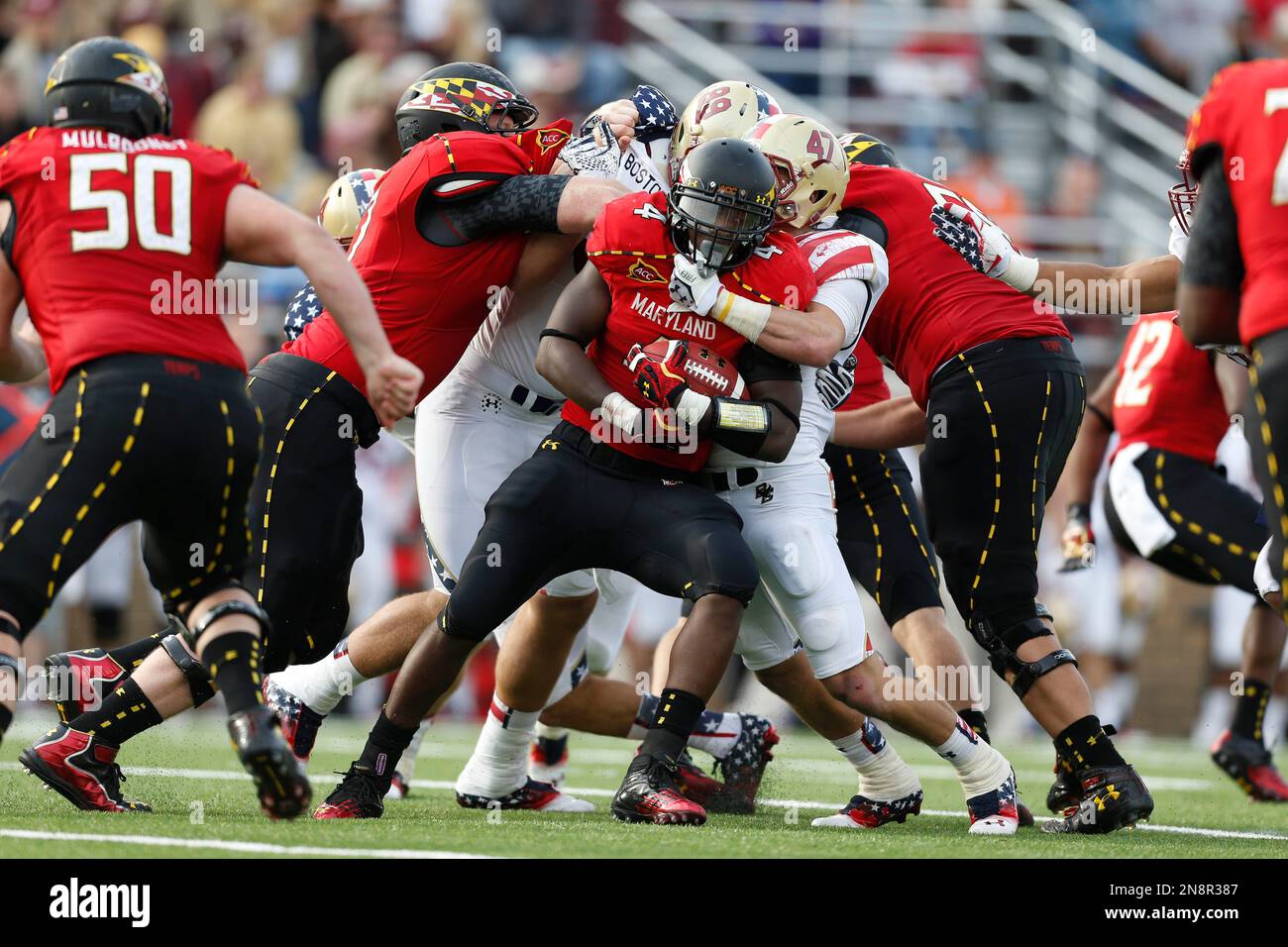 Boston College defensive back Spenser Rositano (47) tackles Maryland ...