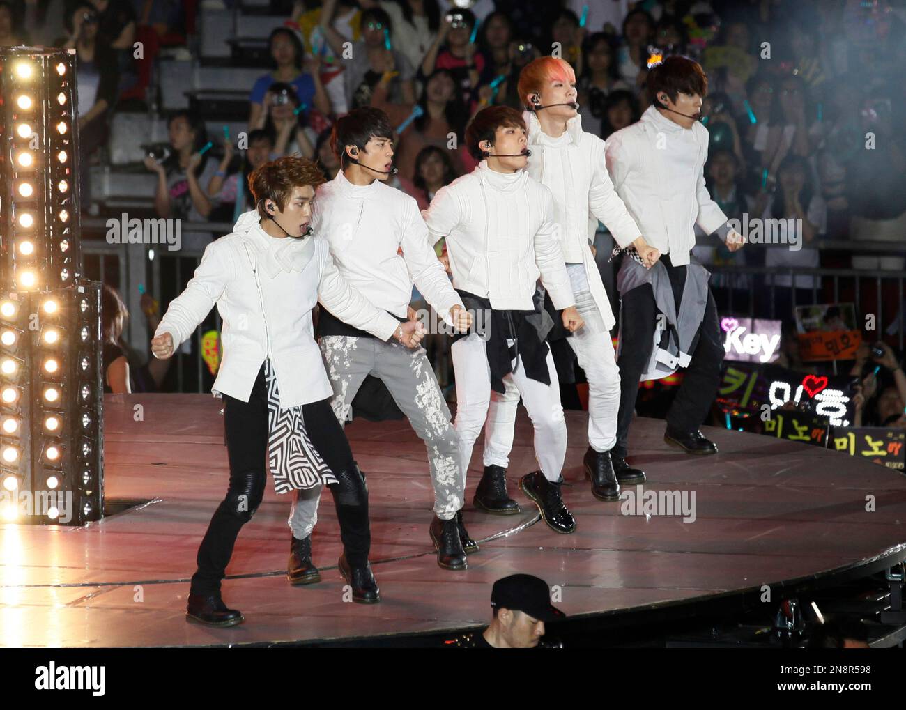 Members of South Korean band SHINee perform during their concert in ...