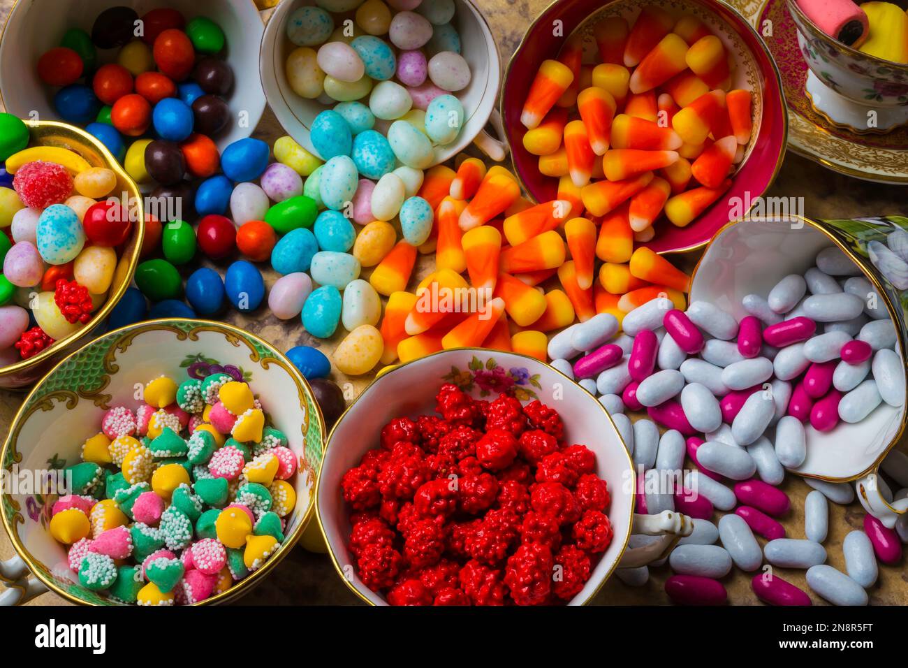 Tea Cups And Candy Stock Photo - Alamy