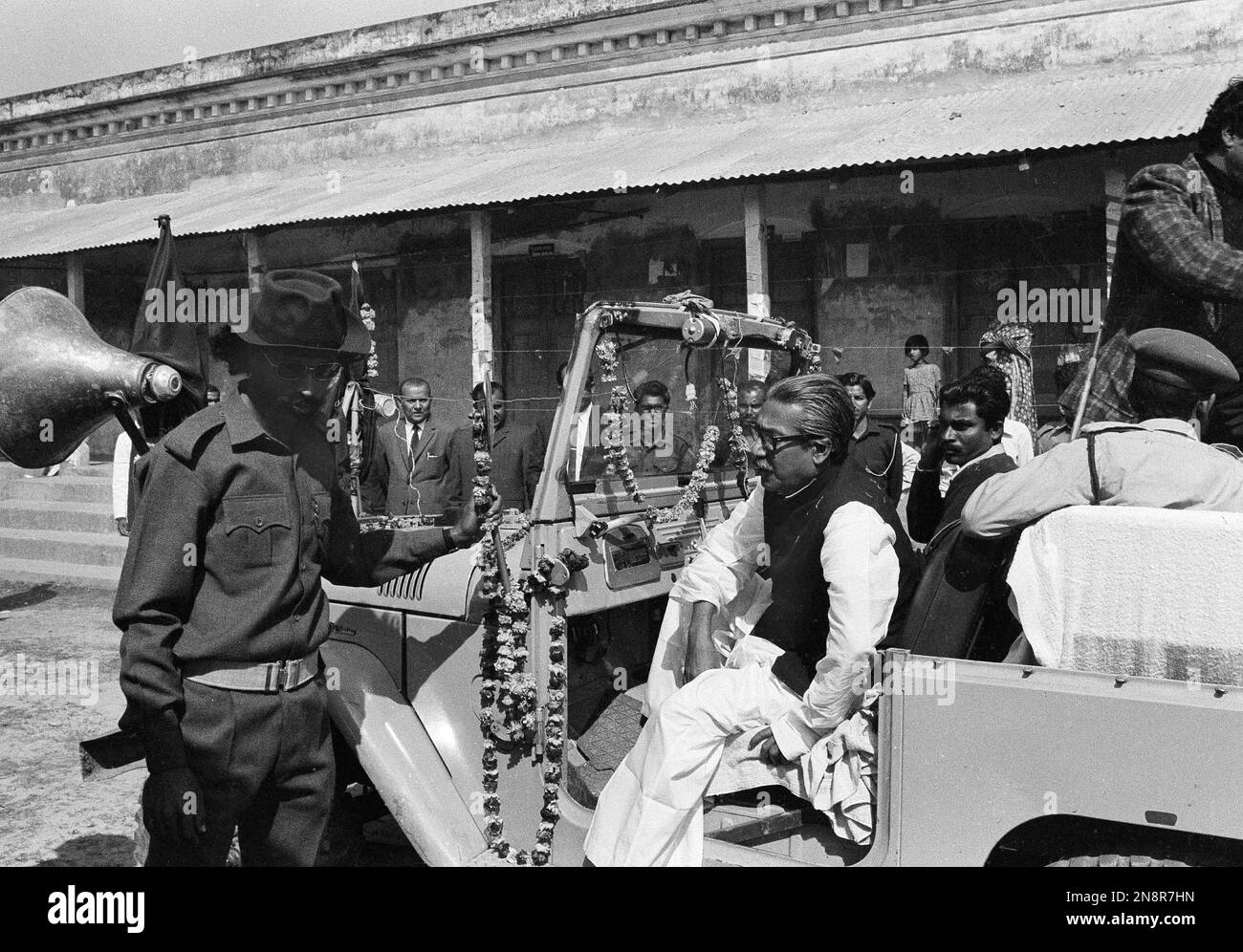 Bangladeshi leader Sheikh Mujibur Rahman sits in a car as he arrives in ...