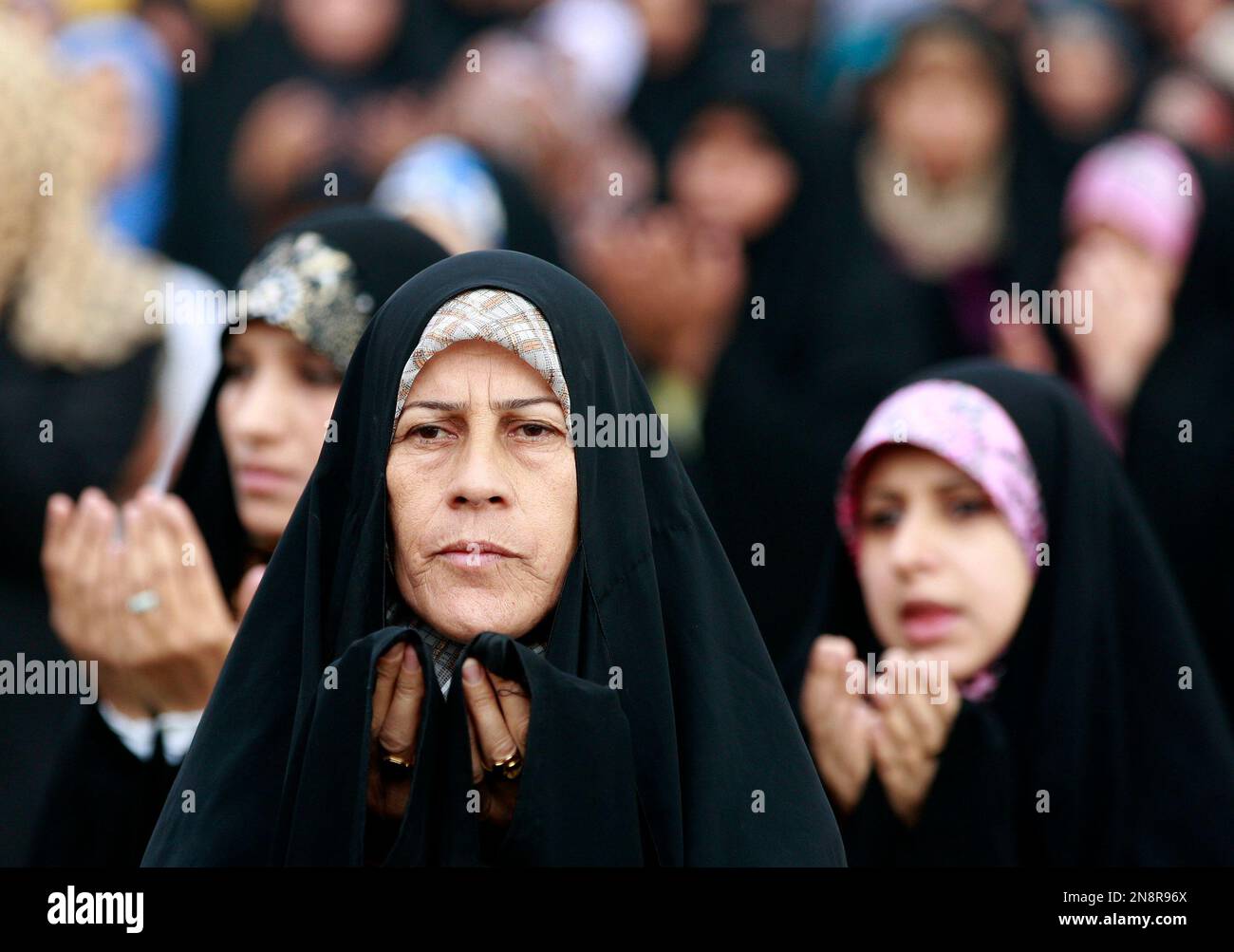 Iraqi Shiite Muslim women attend the Eid al-Adha prayer, outside the ...