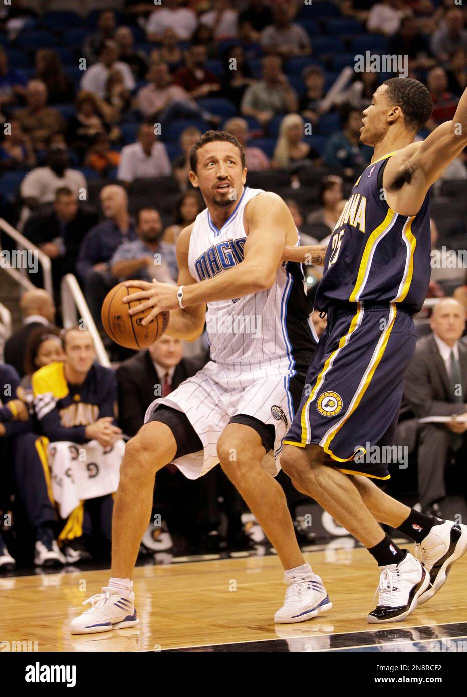 Orlando Magic's Hedo Turkoglu, left, looks for a shot over Indiana ...