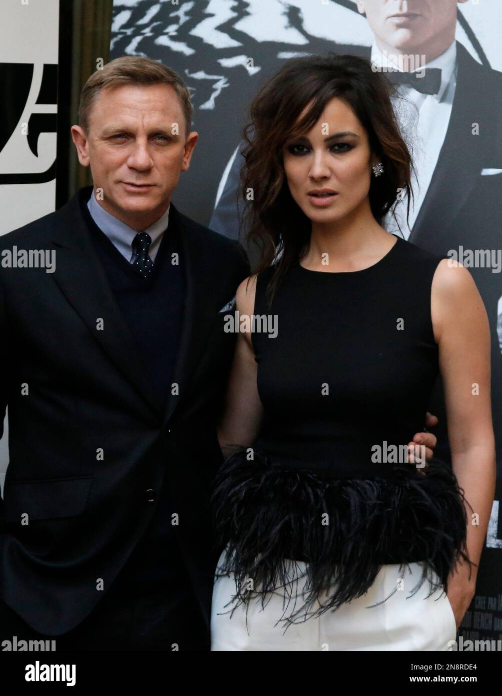 British actor Daniel Craig, left and French actress Berenice Marlohe pose for photographers ...