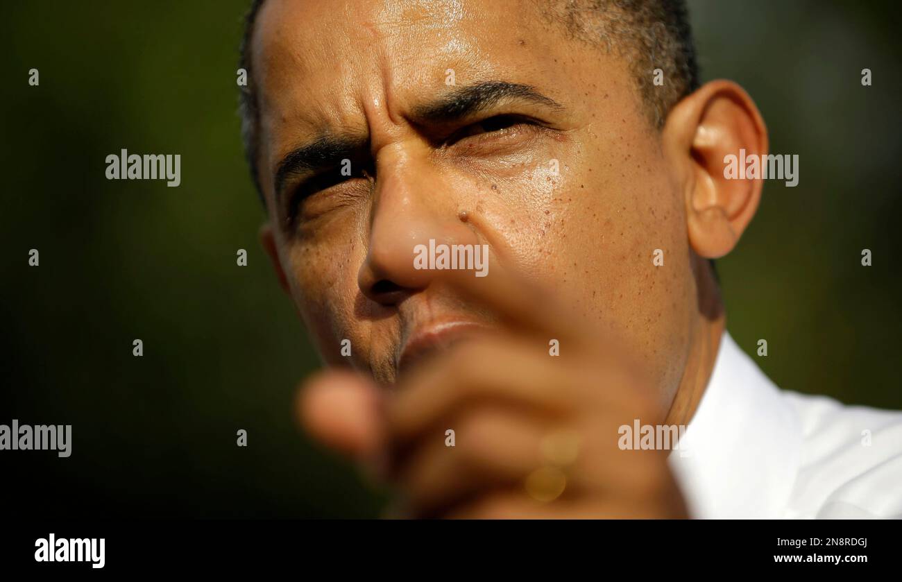 President Barack Obama gestures while speaking at a campaign event at ...
