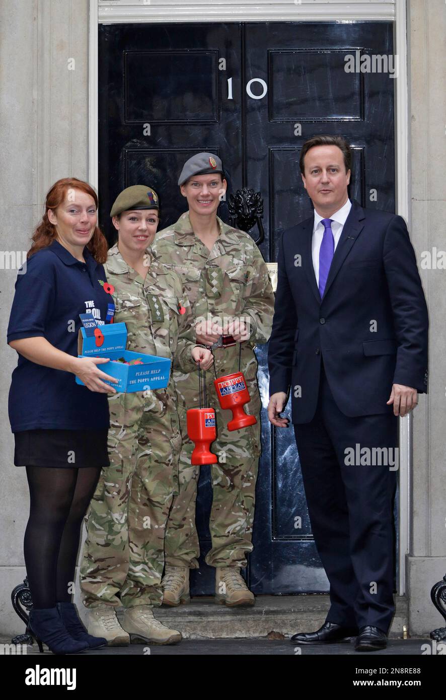 Britain's Prime Minister David Cameron, right, accompanied by, from ...
