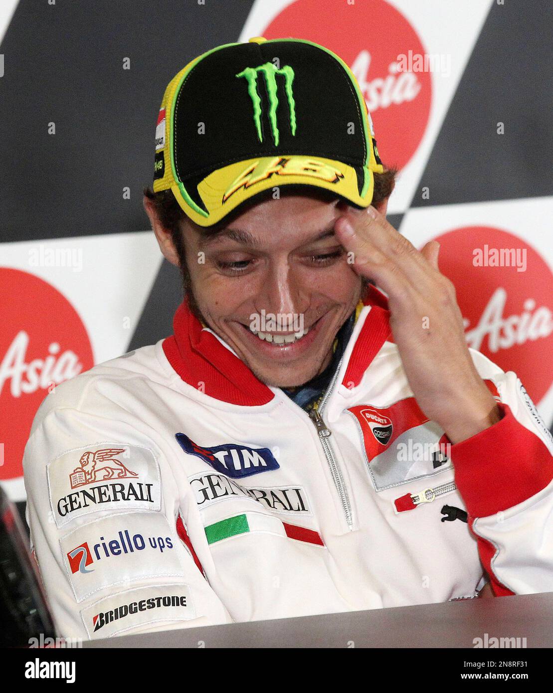 Ducati MotoGP rider Valentino Rossi of Italy laughs at a funny comment ...