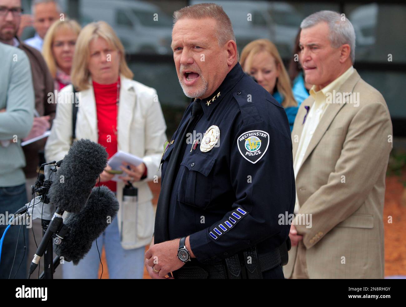 Westminster Police Chief Lee Birk, center, and Jefferson County ...