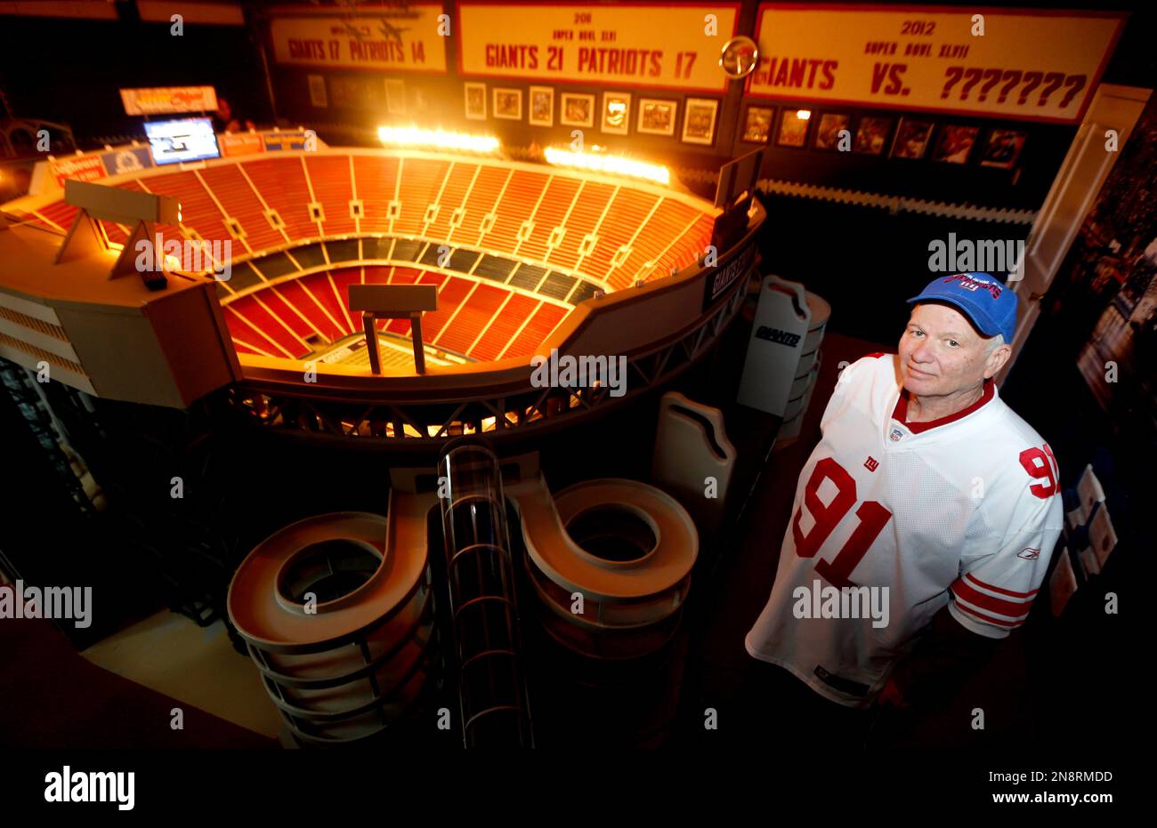 Don Martini poses for photos next to his miniature replica of Giants ...