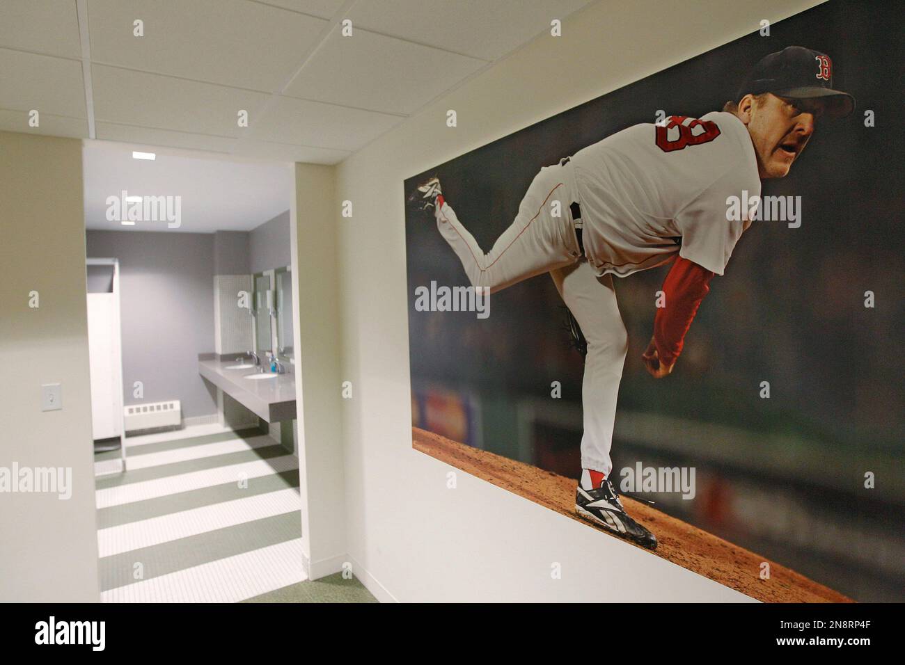 A poster of Curt Schilling pitching with a "bloody sox" hangs in the ...