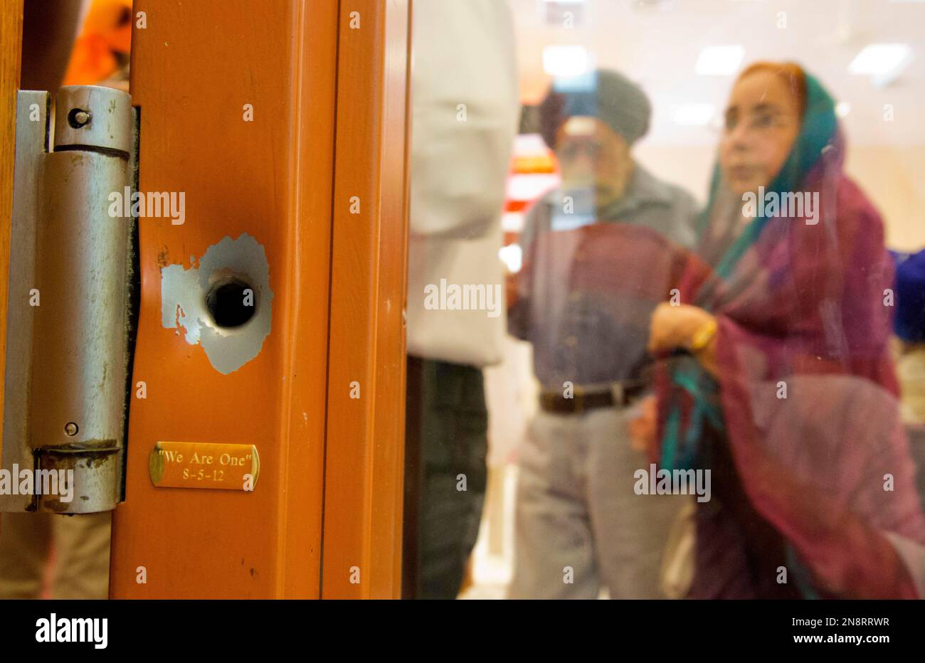 FILE - This Aug. 12, 2012 file photo shows a bullet hole on a door ...