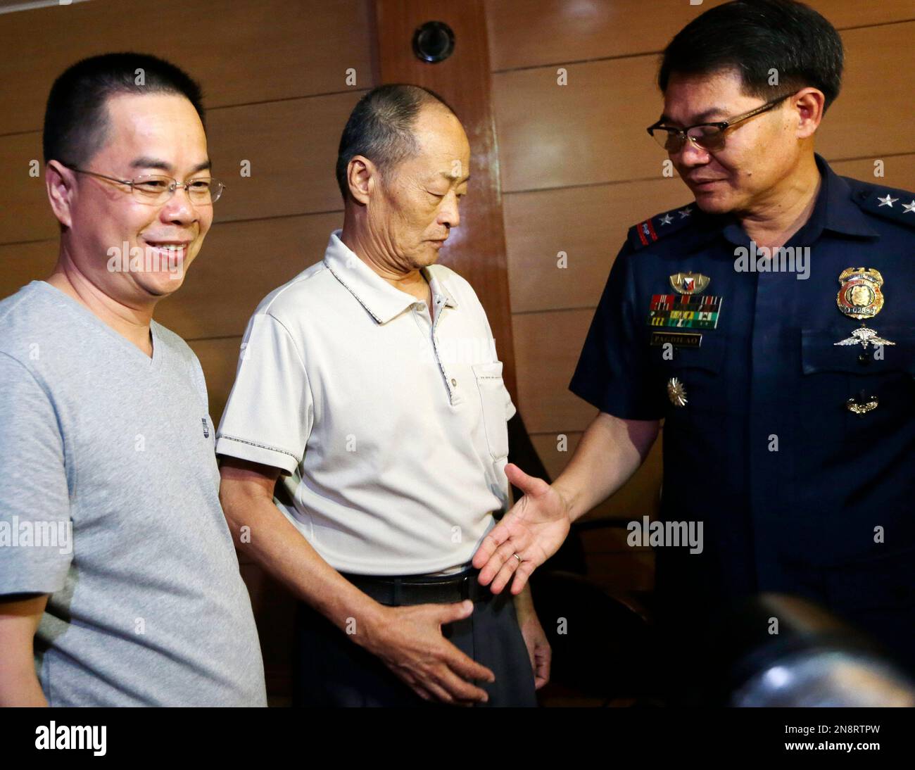 Philippine National Police Director Samuel Pagdilao, right, meets ...