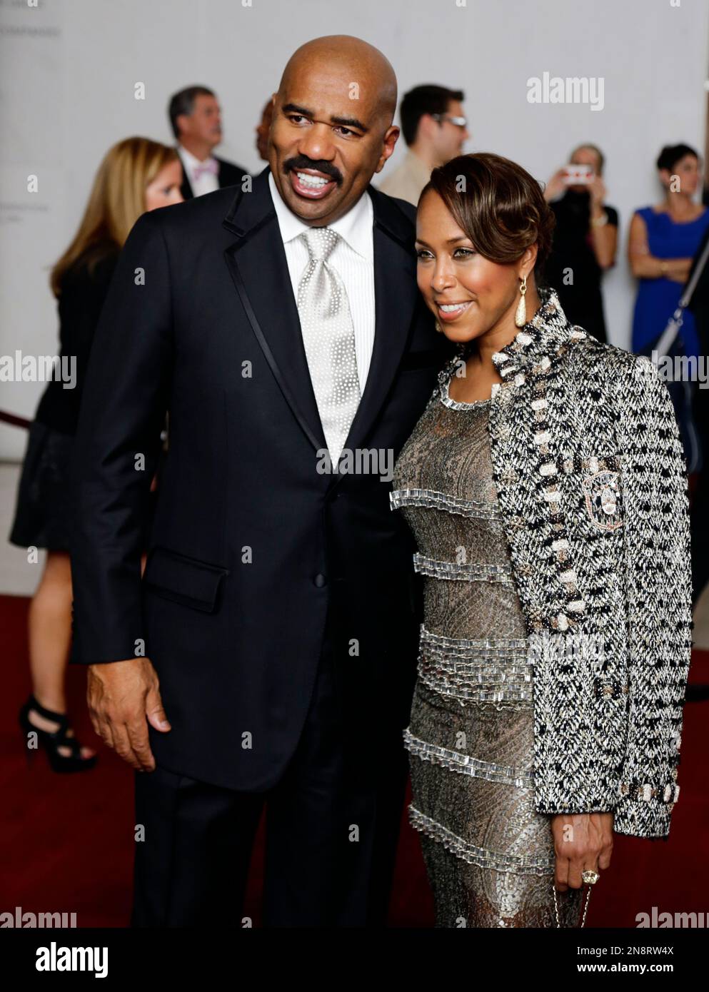 Entertainer Steve Harvey, left, with his wife Marjorie Bridges, pose ...
