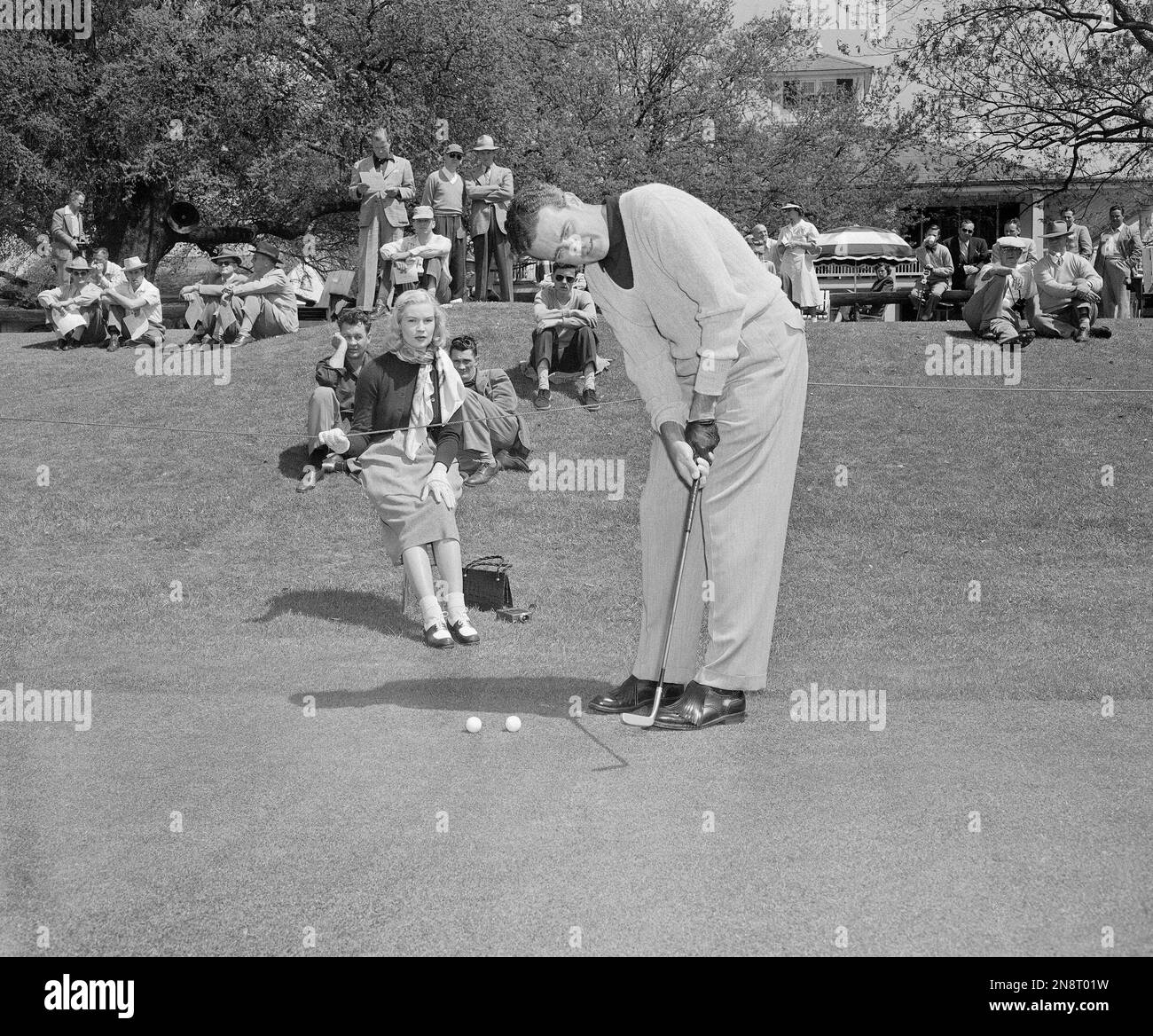 Robert Sweeny putts on second green, during third round of 1950 Masters ...