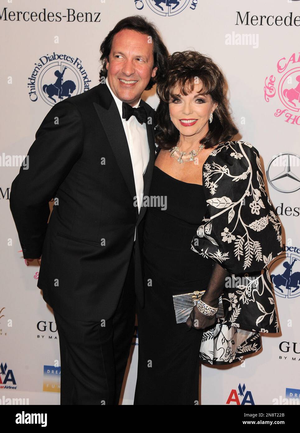 Percy Gibson and Joan Collins arrive at The Carousel of Hope at The ...