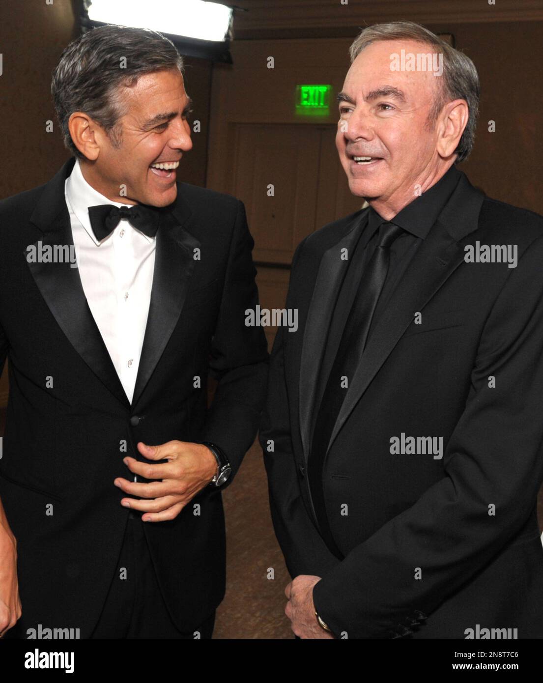 George Clooney, left, and Neil Diamond attend The Carousel of Hope at ...