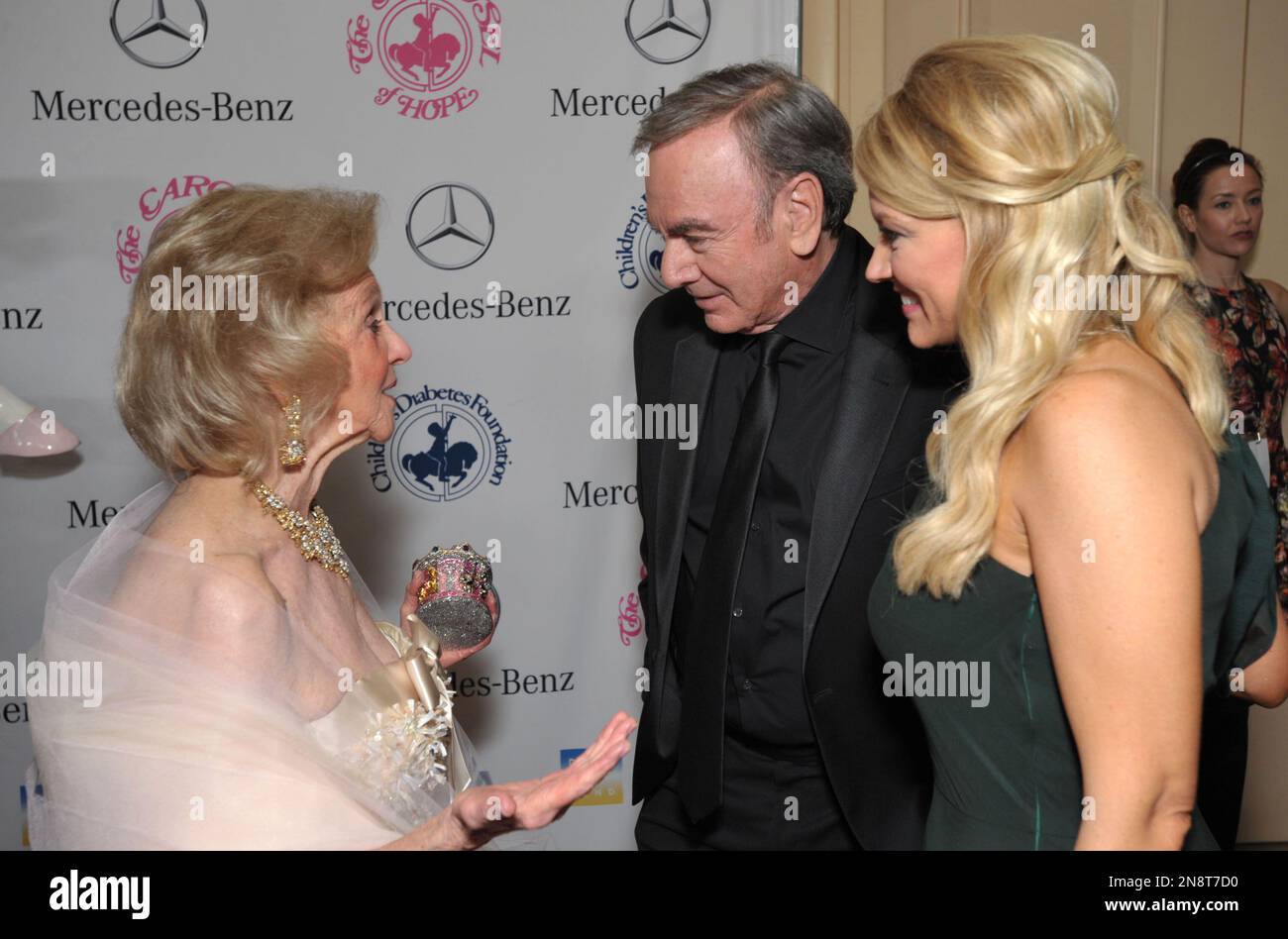 Barbara Davis, Neil Diamond, and Katie McNeil attend The Carousel of ...