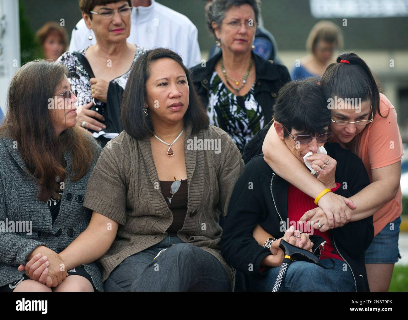 Family members of victims of the 2003 Station nightclub fire, from left ...