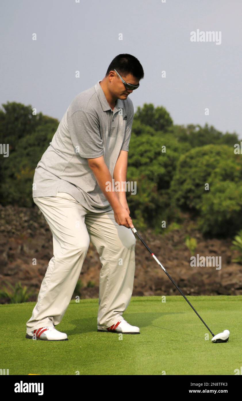 Former Chinese NBA star Yao Ming tees off during the pro-am games at ...