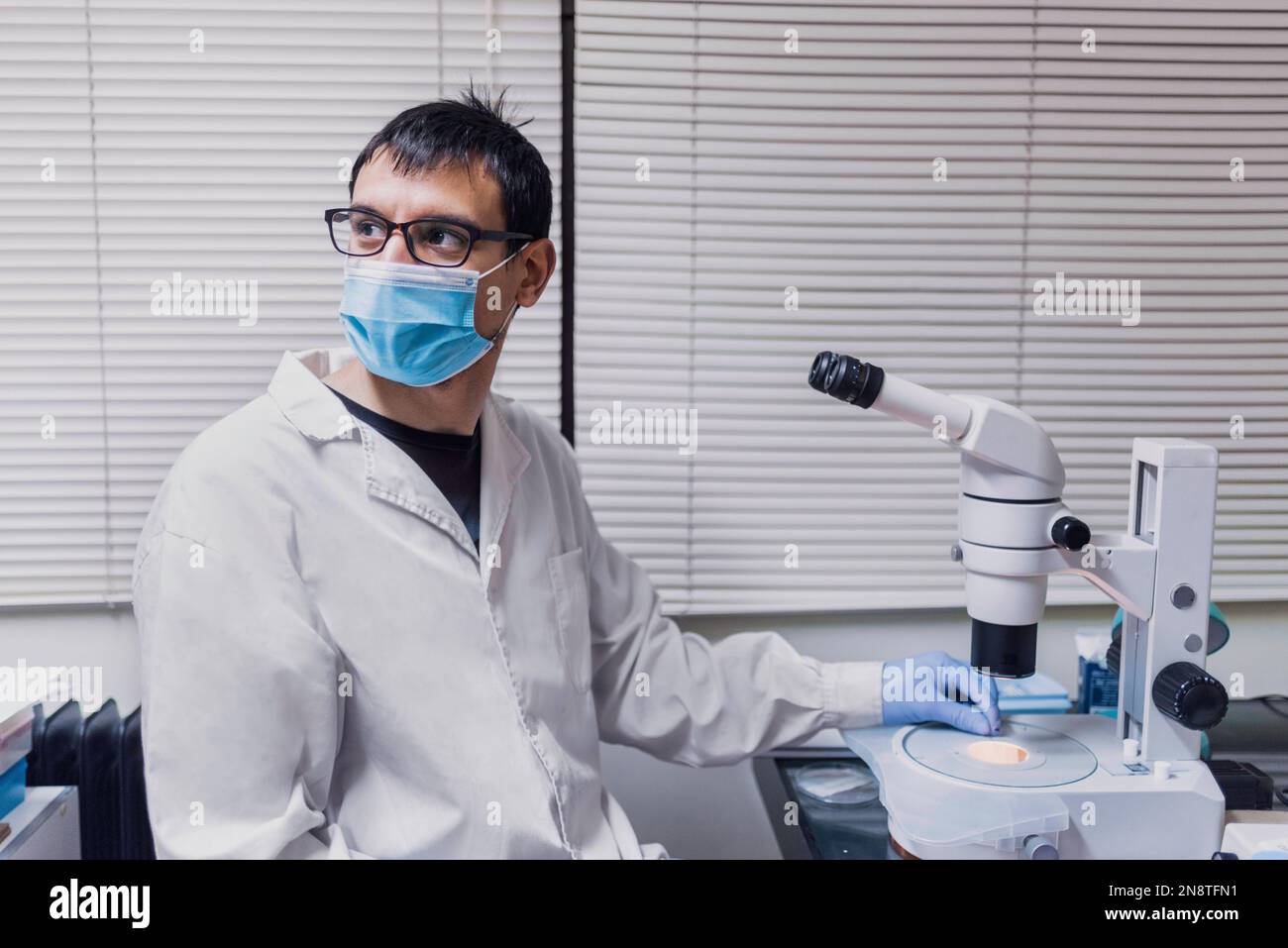 Male Scientist Using Microscopy in Laboratory Stock Photo - Alamy