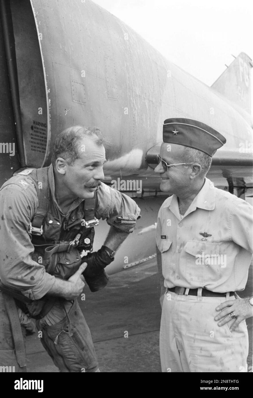 Air Force Col. Robin Olds, left, talks with Brig. Gen. Franklin Nichols ...