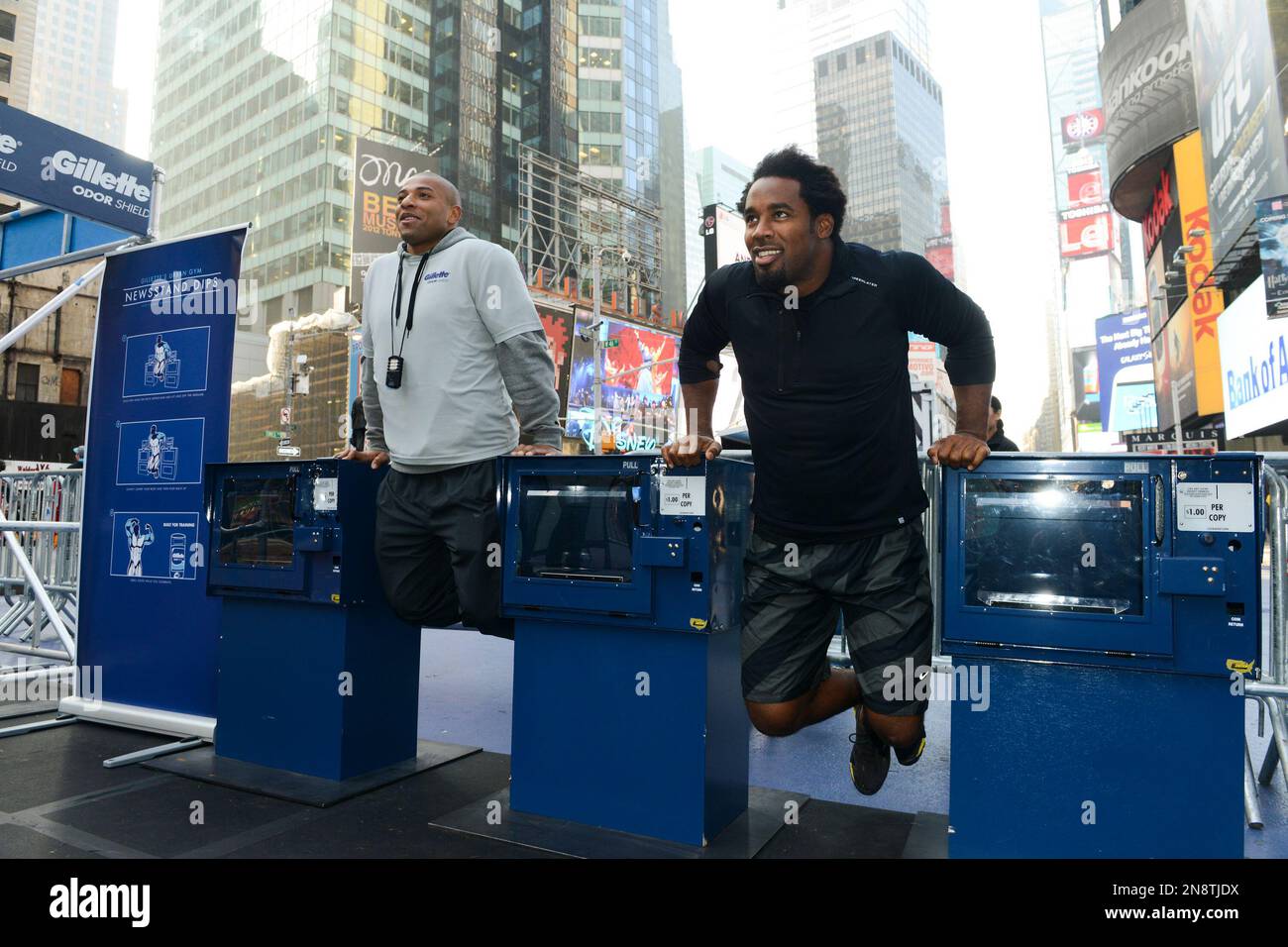 Professional athlete trainer EJ Barthel, left, gives football star ...