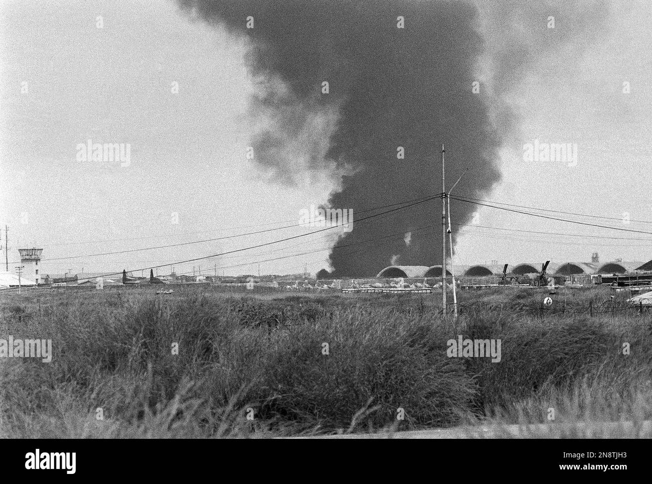 Black smoke rises from napalm bomb dump set a fire by rocket attack on ...