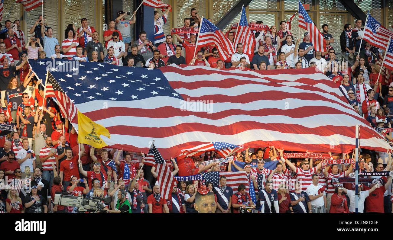 United States soccer fans cheer as they unfurled a large American flag ...