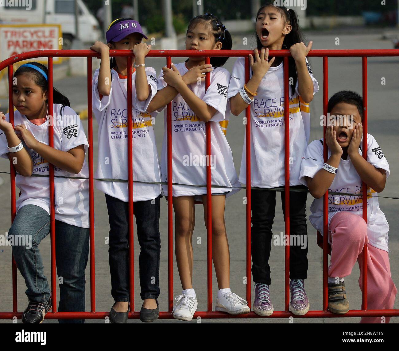 Filipino school children cheer during a relay marathon called "Race for ...