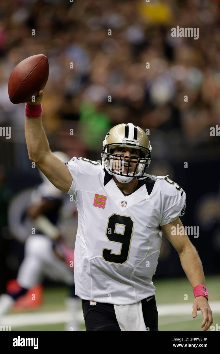Drew Brees reacts after throwing a touchdown pass in the first half of ...