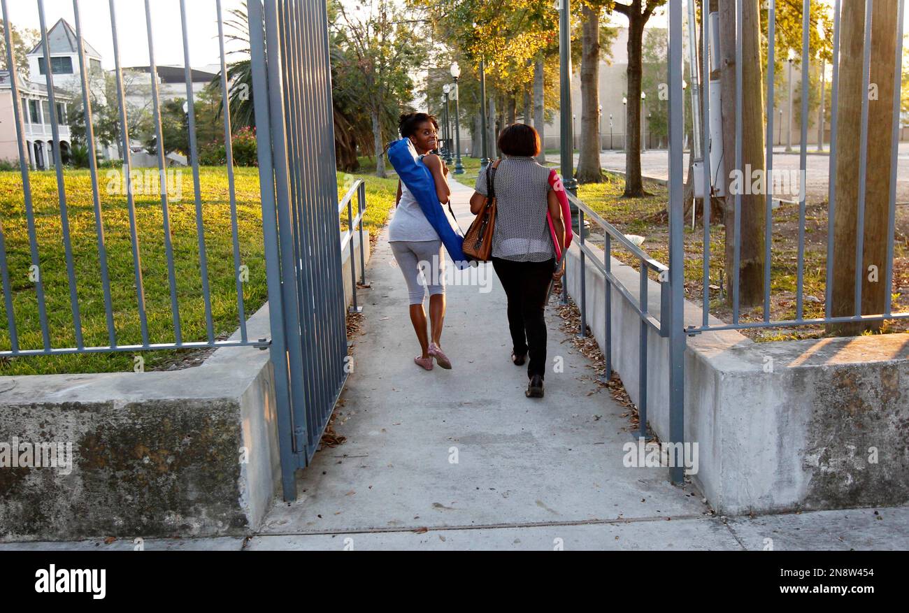Two women enter Armstrong Park for an evening concert in the Treme ...