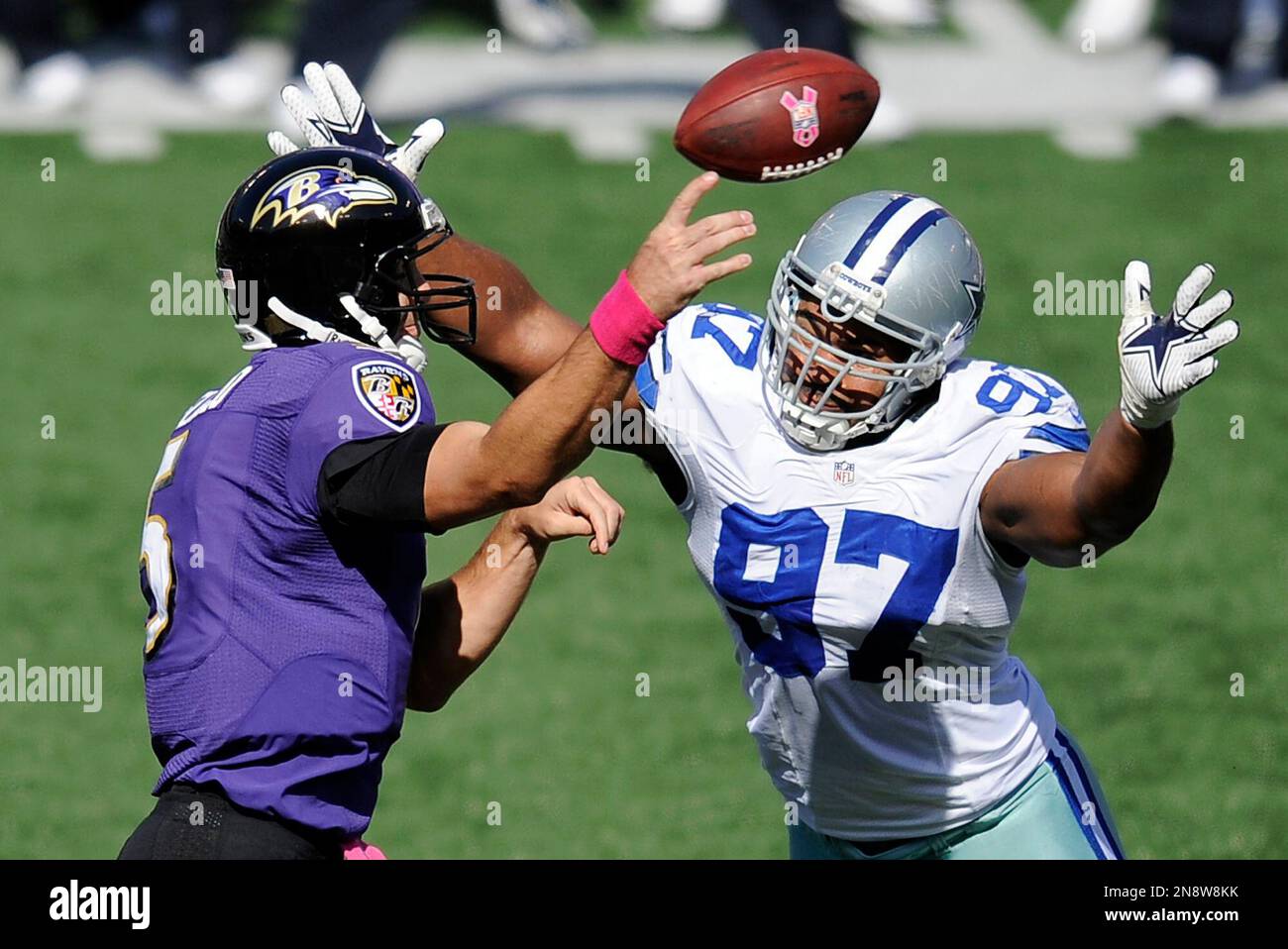 Baltimore Ravens quarterback Joe Flacco, left, throws to a receiver as ...