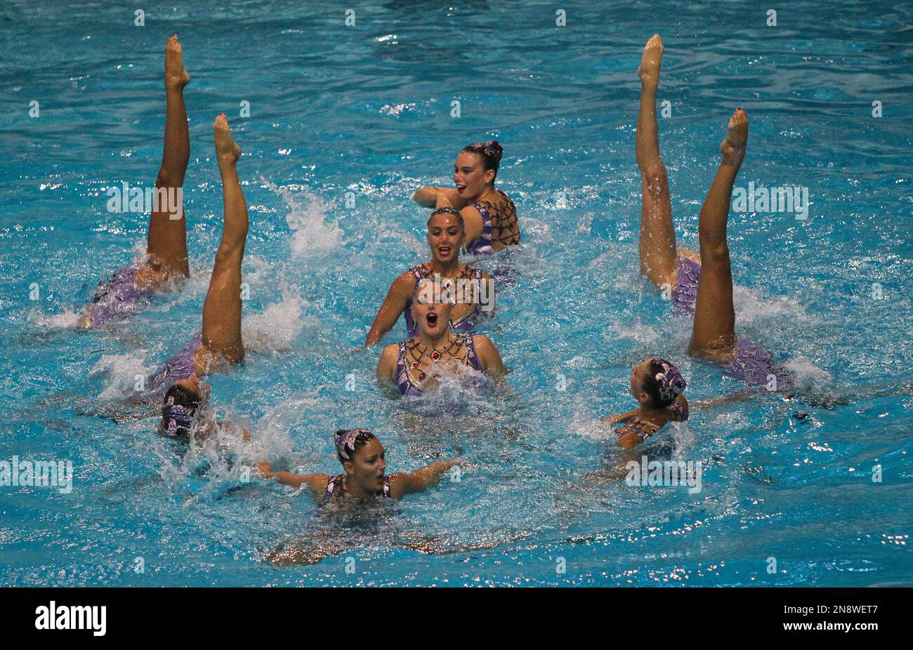 Greek swimmers perform the team free combination during the ...