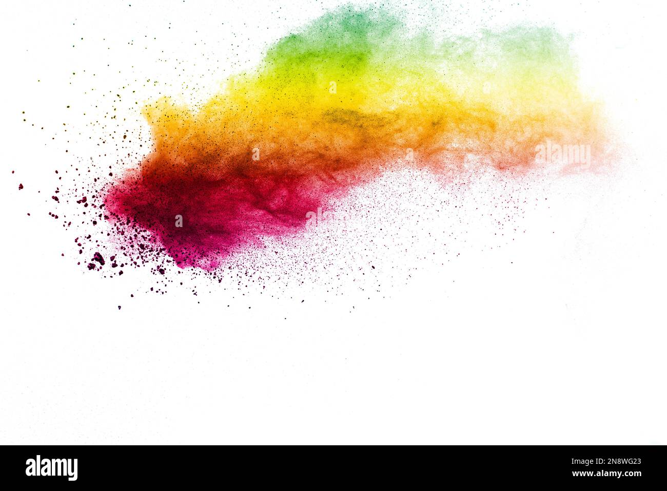 Red yellow and green dust particles explosion on white background ...