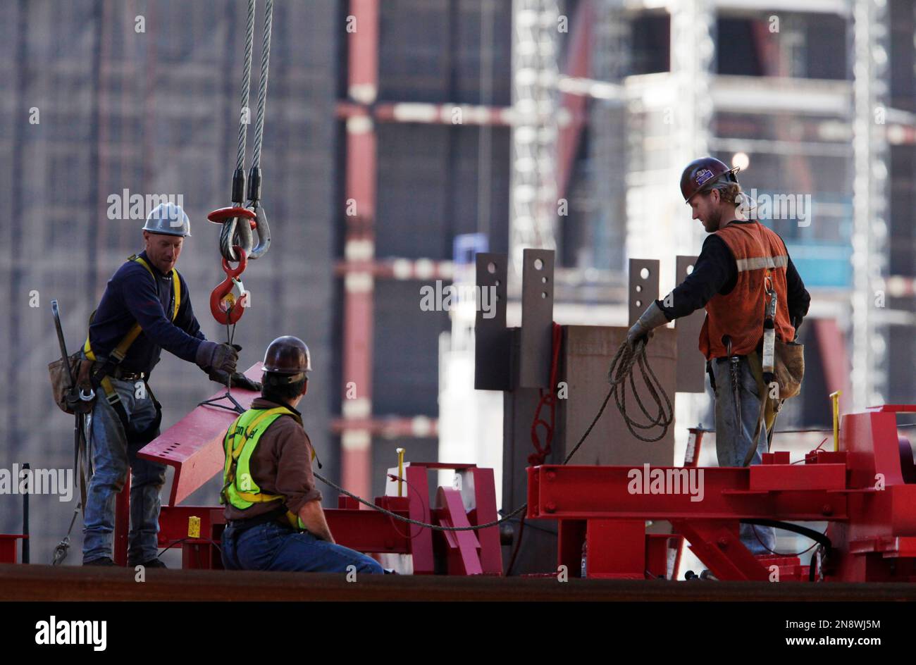 In this photo of Thursday, Oct. 11, 2012, an ironworker guides a steel ...