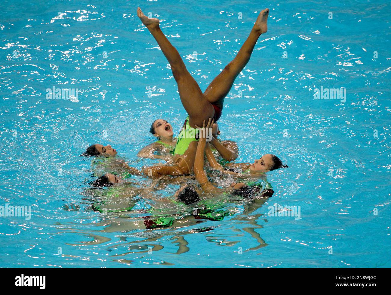 Egyptian swimmers perform the team free routine during Synchronized ...