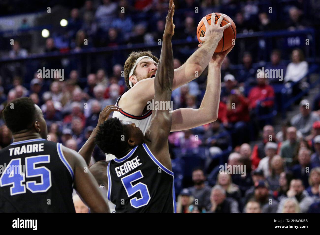Gonzaga forward Drew Timme, back, shoots while defended by BYU forward ...