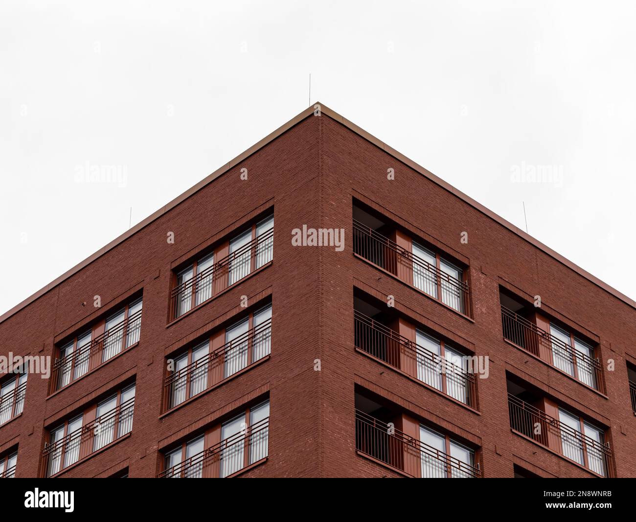 Corner of a house. Modern facade of a residential building in a city ...