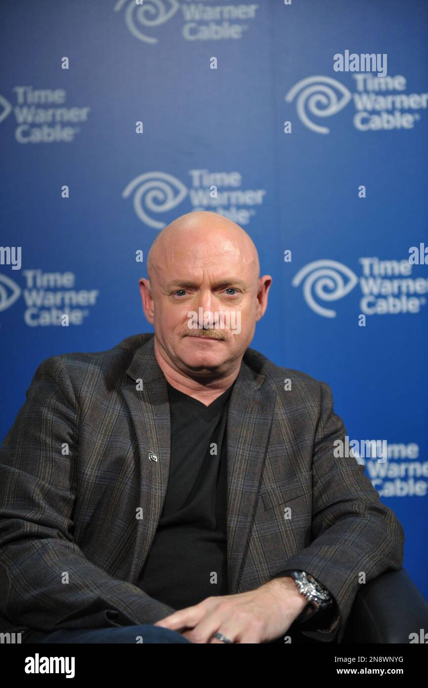 Captain Mark Kelly, Commander of the Space Shuttle Endeavour, poses for ...