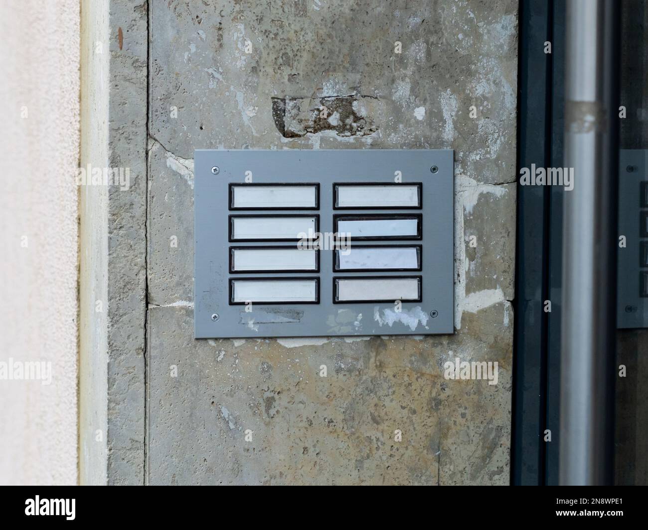 Dirty doorbell panel without names. Template with blank spaces next to ...