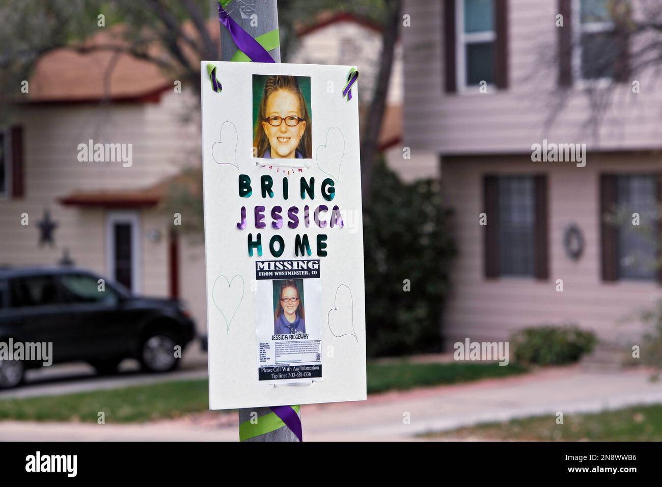 A missing person sign is posted on a lamp post near the home of ten ...